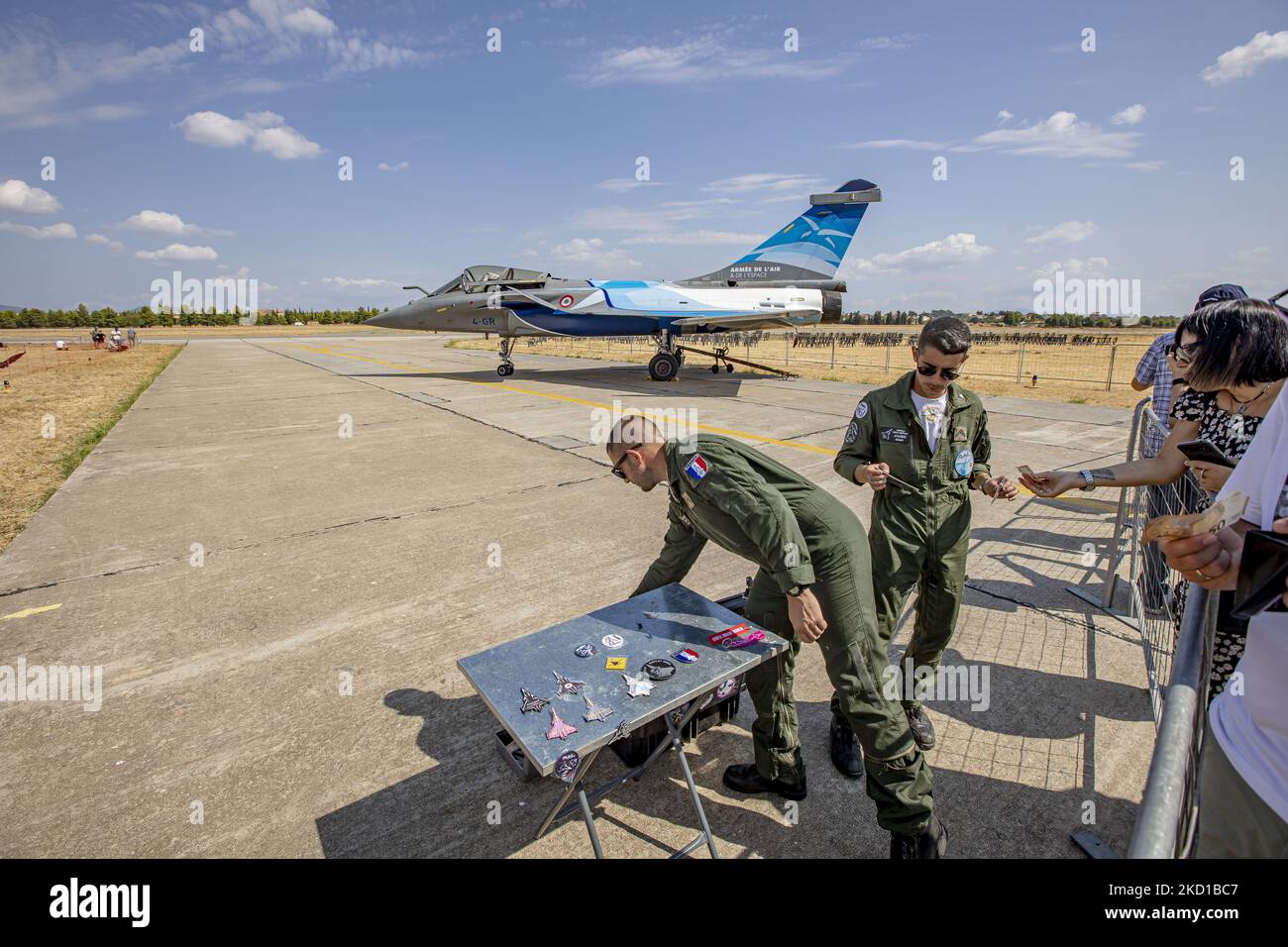 Crew from the French Solo Display team sells souvenirs from the Rafale ...