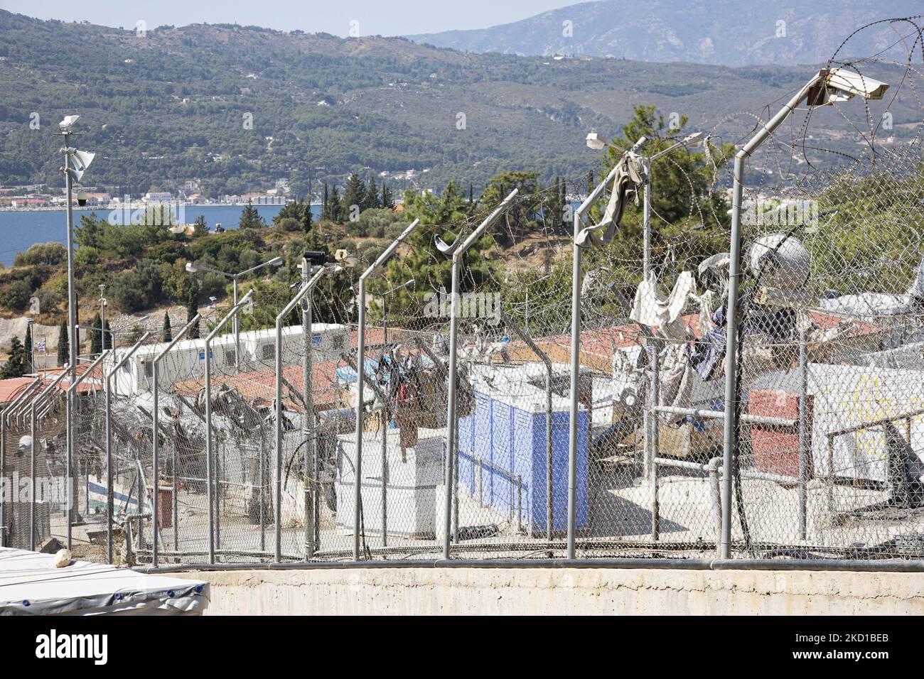 Fence, barbed wire, camera surveillance as seen at the camp. The former ...