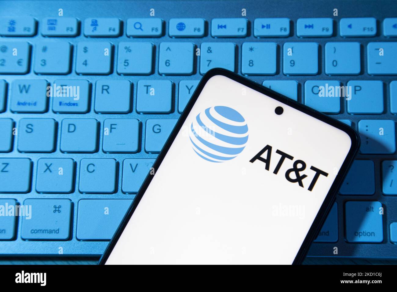 Photo illustration of AT&T logo symbol displayed on a mobile phone ...
