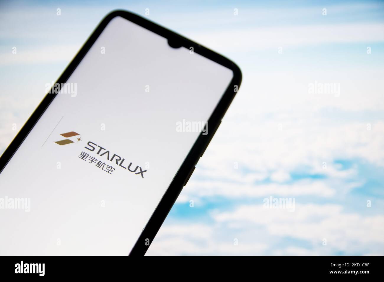 In this photo illustration a Starlux Airlines logo seen displayed on a ...