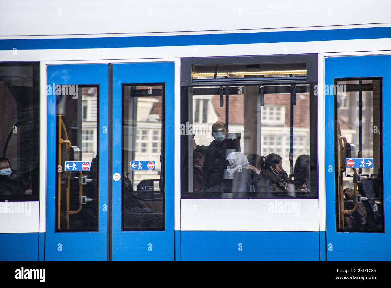 People are spotted in the tramway wearing facemask.Tram in Amsterdam is ...