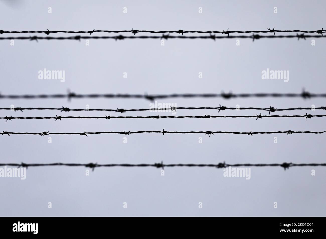 Barbed wire fence at the former Nazi-German Auschwitz II-Birkenau ...