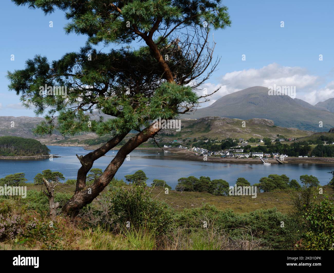 The summer loch and mountain landscape of Loch Shieldaig and village in ...