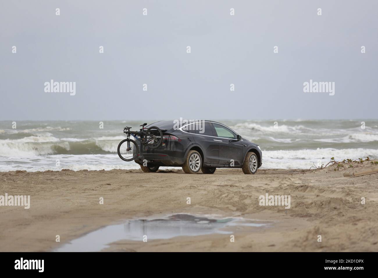 An adventurous Tesla driver drives along Boca Chica Beach next to the ...