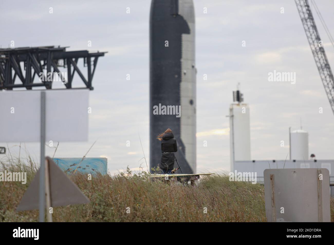 SpaceX live streamer Jessica Kirsh sits on a dune overlooking Starbase ...