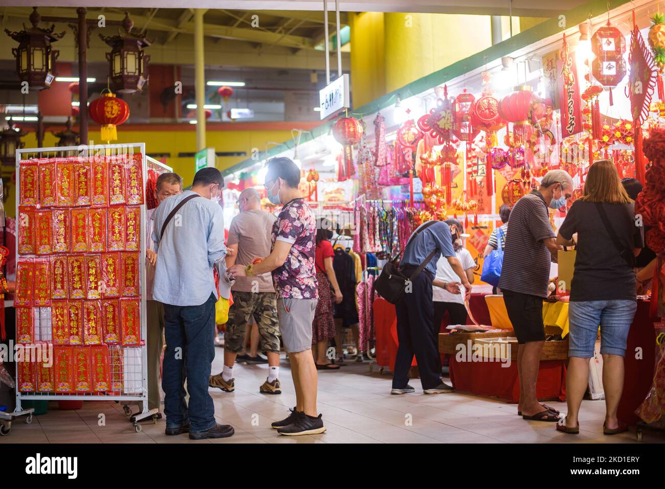 Shoppers look at auspicious chinese decorations in the Kreta Ayer ...
