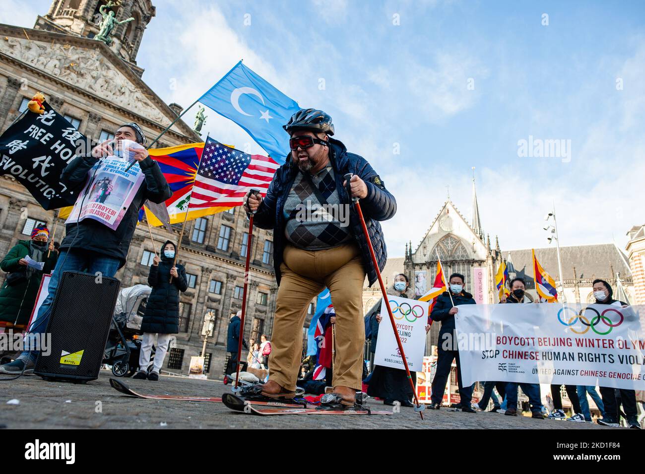 An Uyghur man is skying around the place dragging the Chinese flag behind him, during a ...