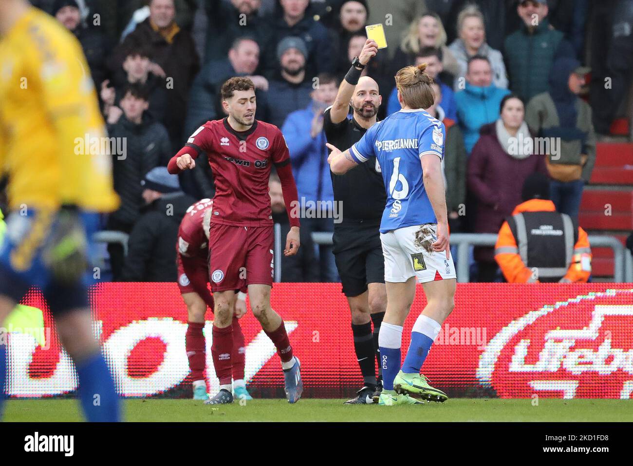 Carl Piergianni of Oldham Athletic is shown a yellow card during the ...