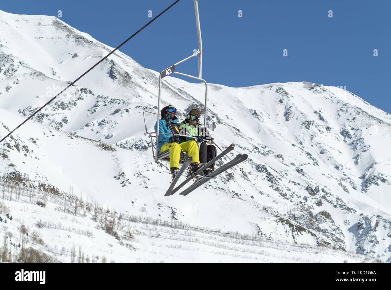 An Iranian couple use a chairlift in Darbandsar ski resort 67Km (42 miles) northeastern Tehran ...