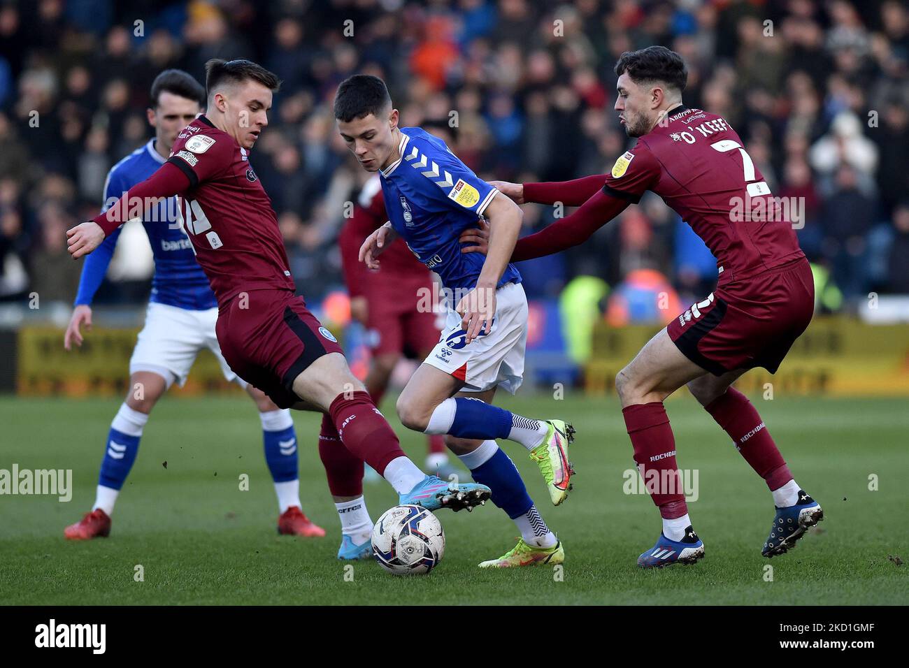 Oldham Athletic's Alex Hunt tussles with Corey O'Keeffe of Rochdale ...