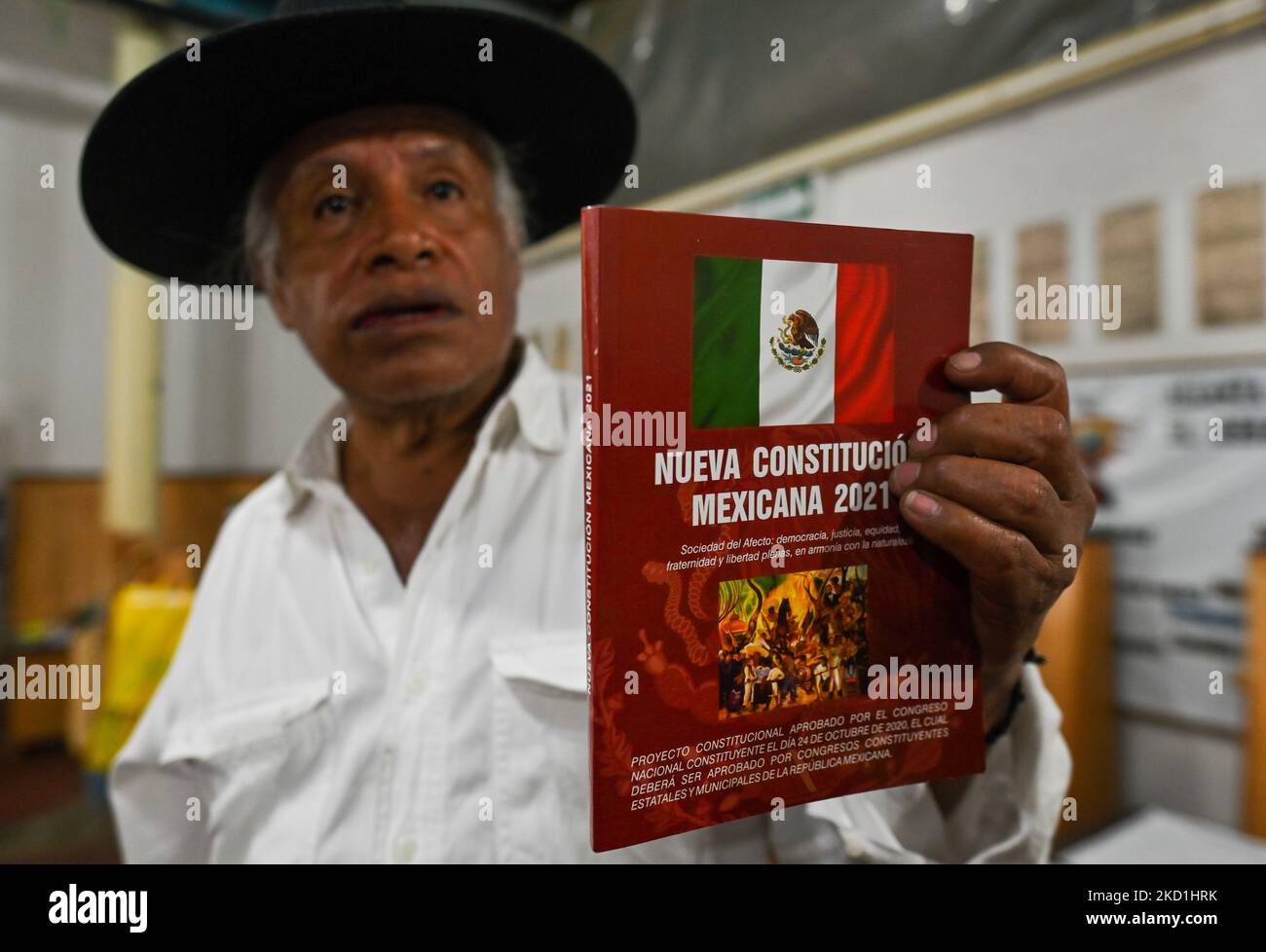 A man holds the copy of the projet of the New Mexican Constitution 2021 ...
