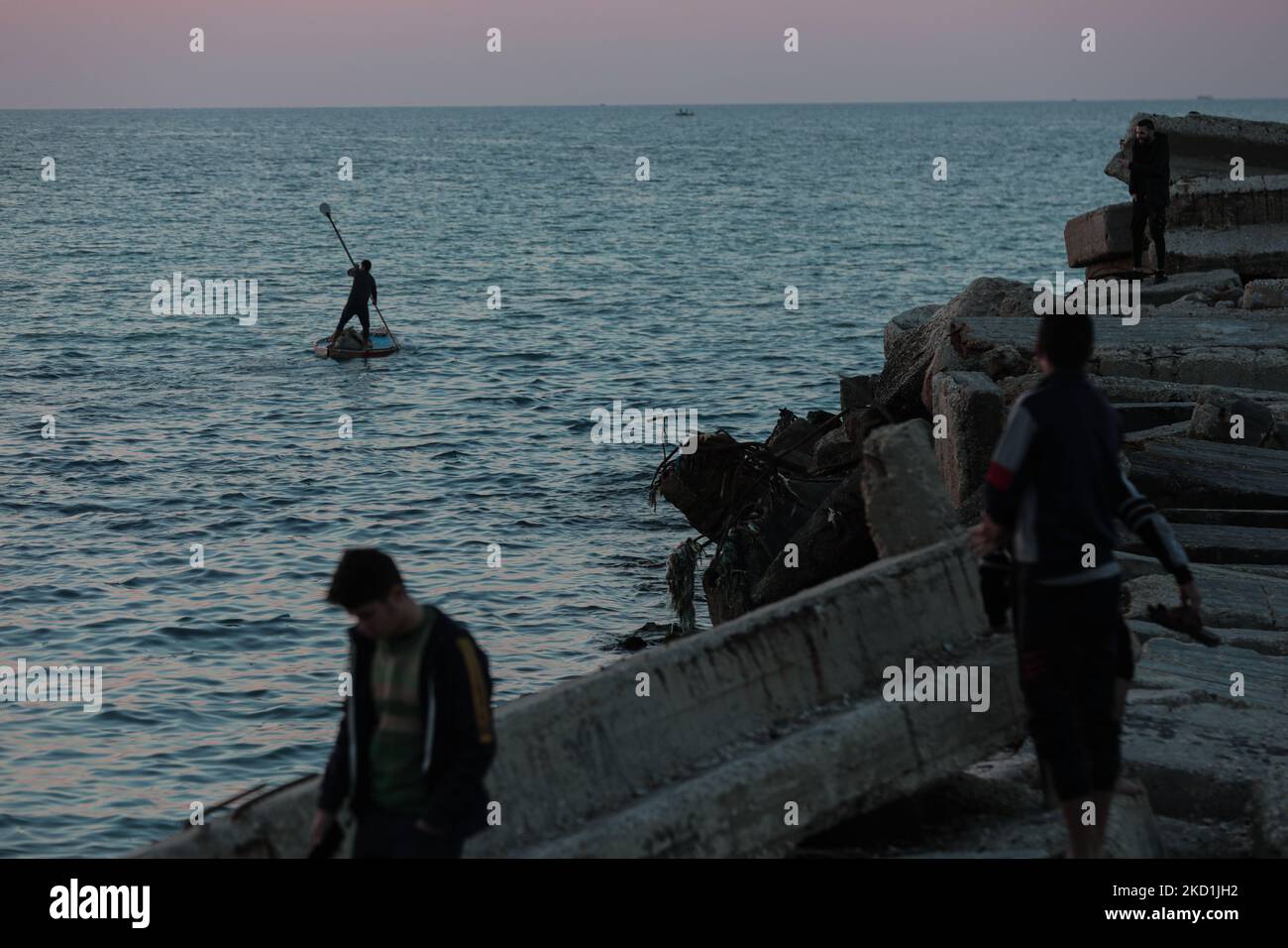 Palestinian fishing boats in the Gaza sea at sunset in Gaza City ...