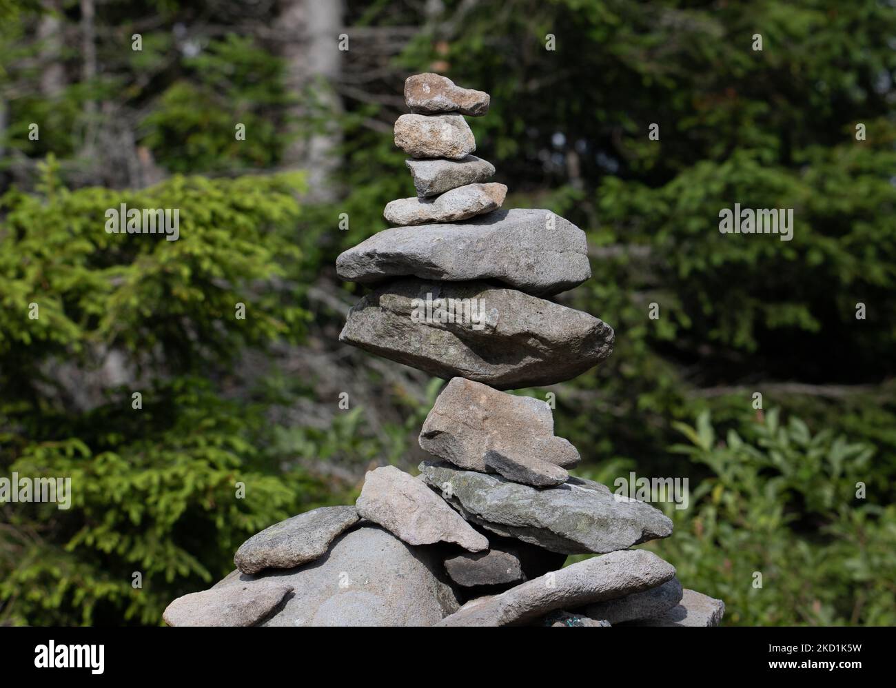 A closeup shot of a stack of stones, a tower of zen stones in the ...