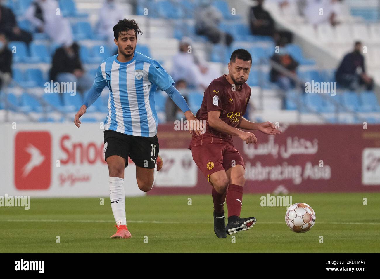 Rodrigo Tabata (12) of Al Sadd passes the ball during the QNB Stars ...