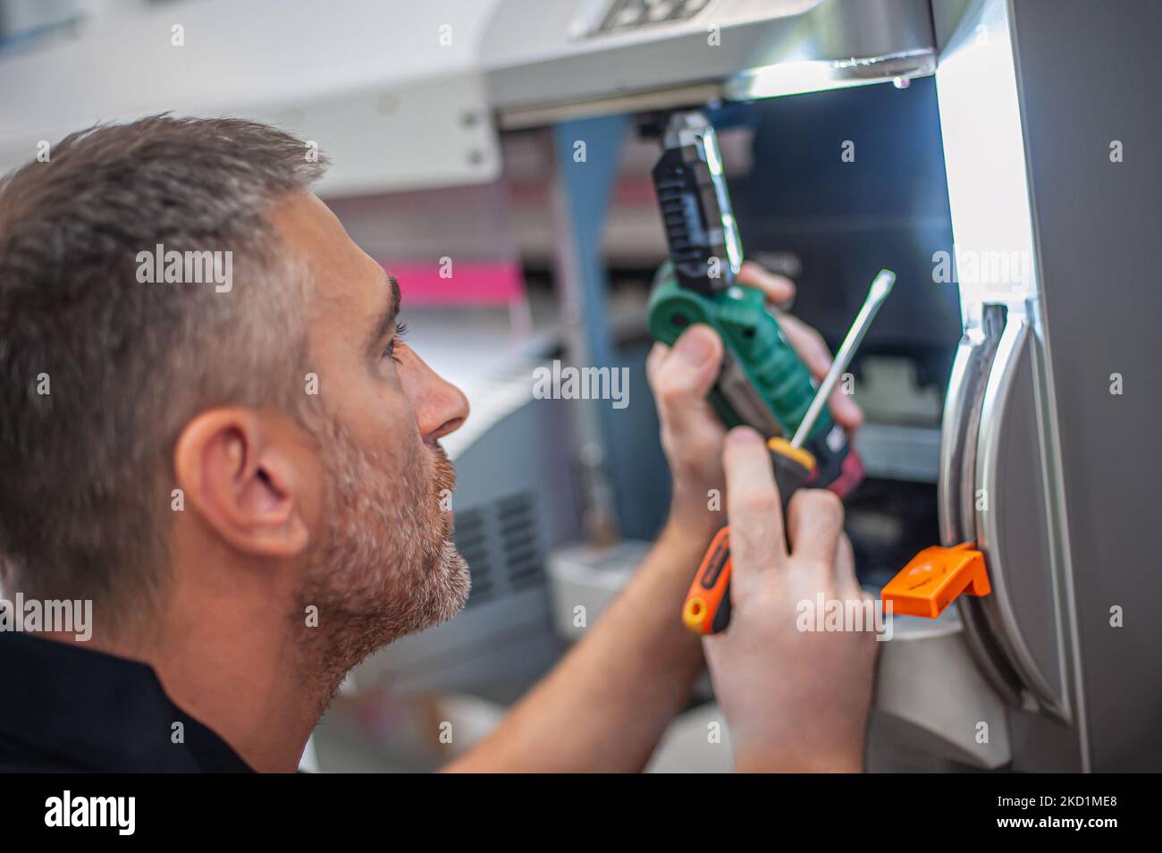 All machines nead maintains. Professional technician troubleshooting ...