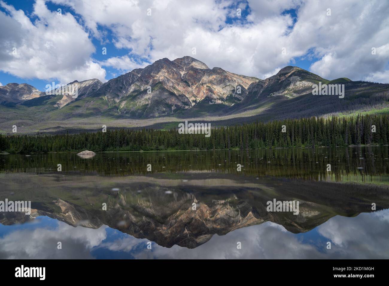 A landscape shot of the Pyramid mountain and its reflection in Pyramid ...