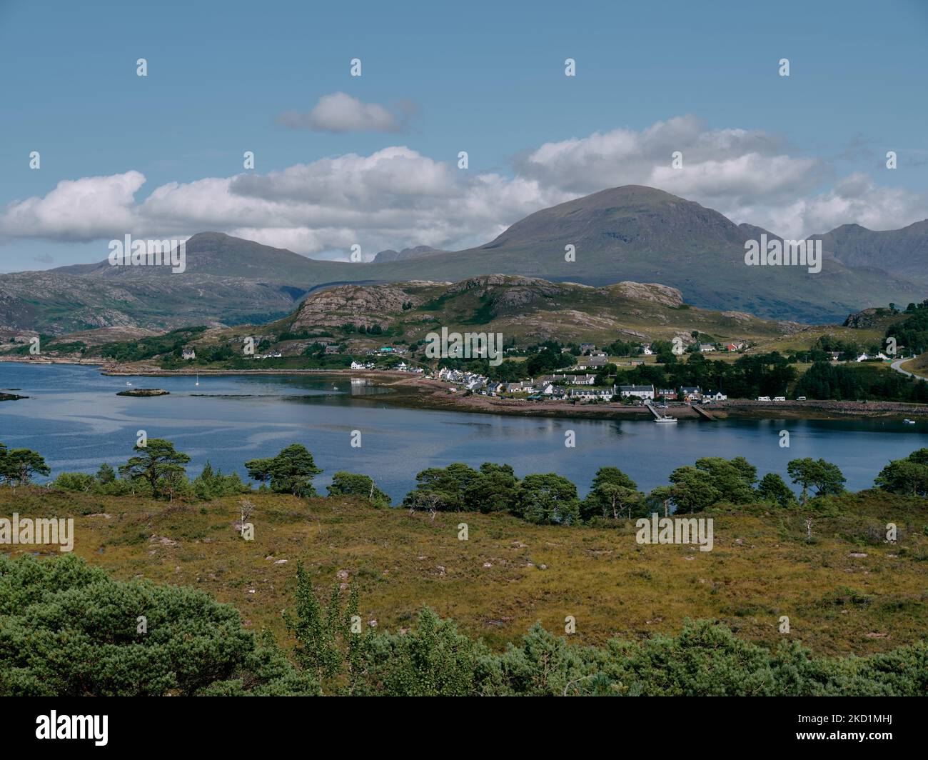 The summer loch and mountain landscape of Loch Shieldaig and village in ...