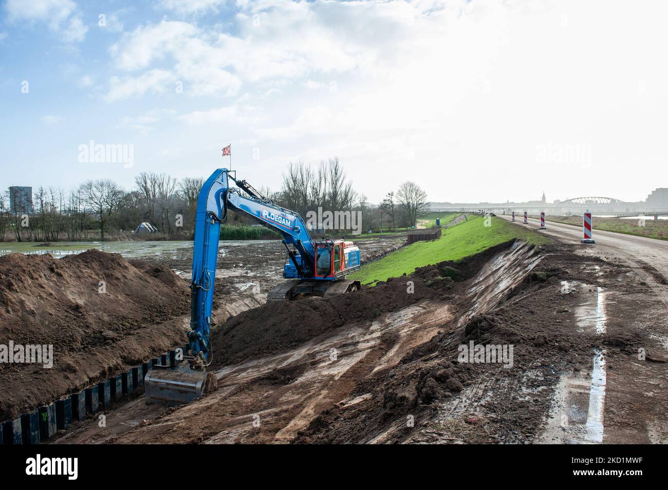 A view of a crane removing the ground placed around the second part of ...