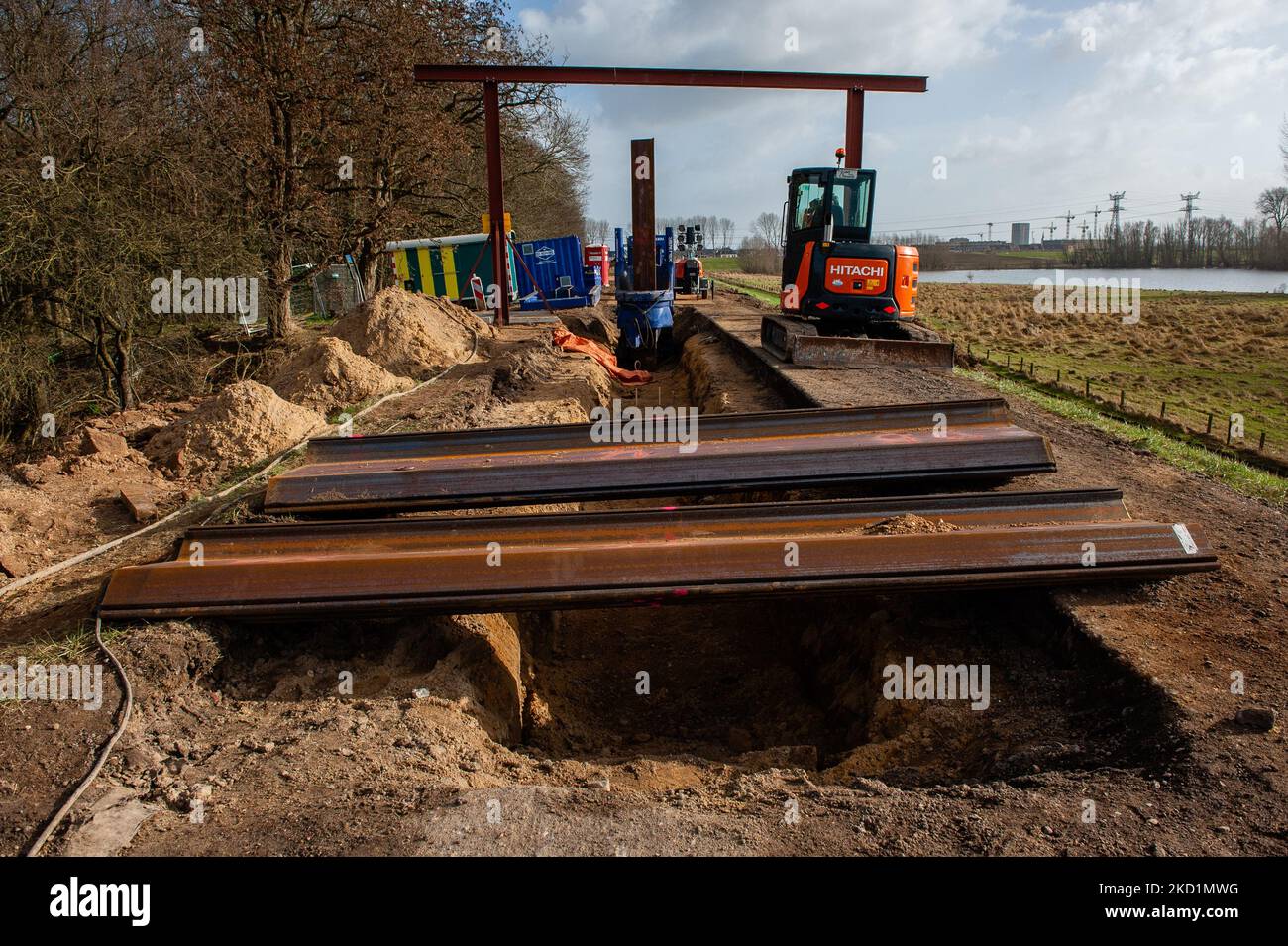 A view of the machines introducing the sheet piles inside the ground ...
