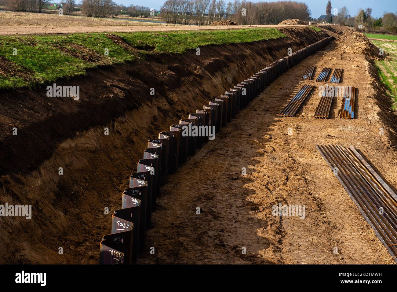 A view of the sheet piles already placed inside the ground around the ...