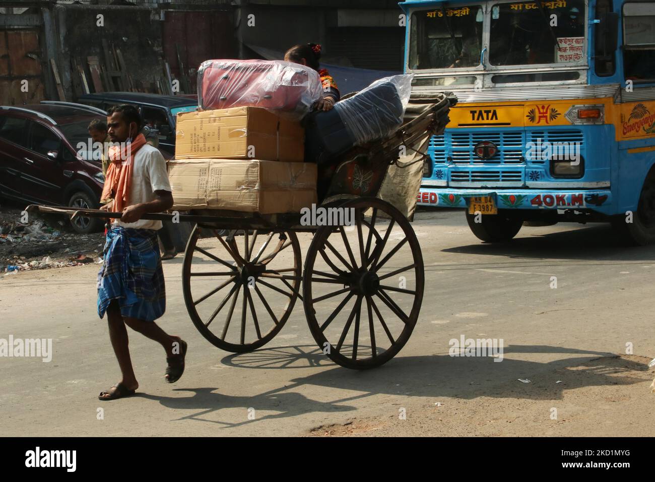 Hand-pulled rickshaw pullers loaded Goods rods during morning in ...