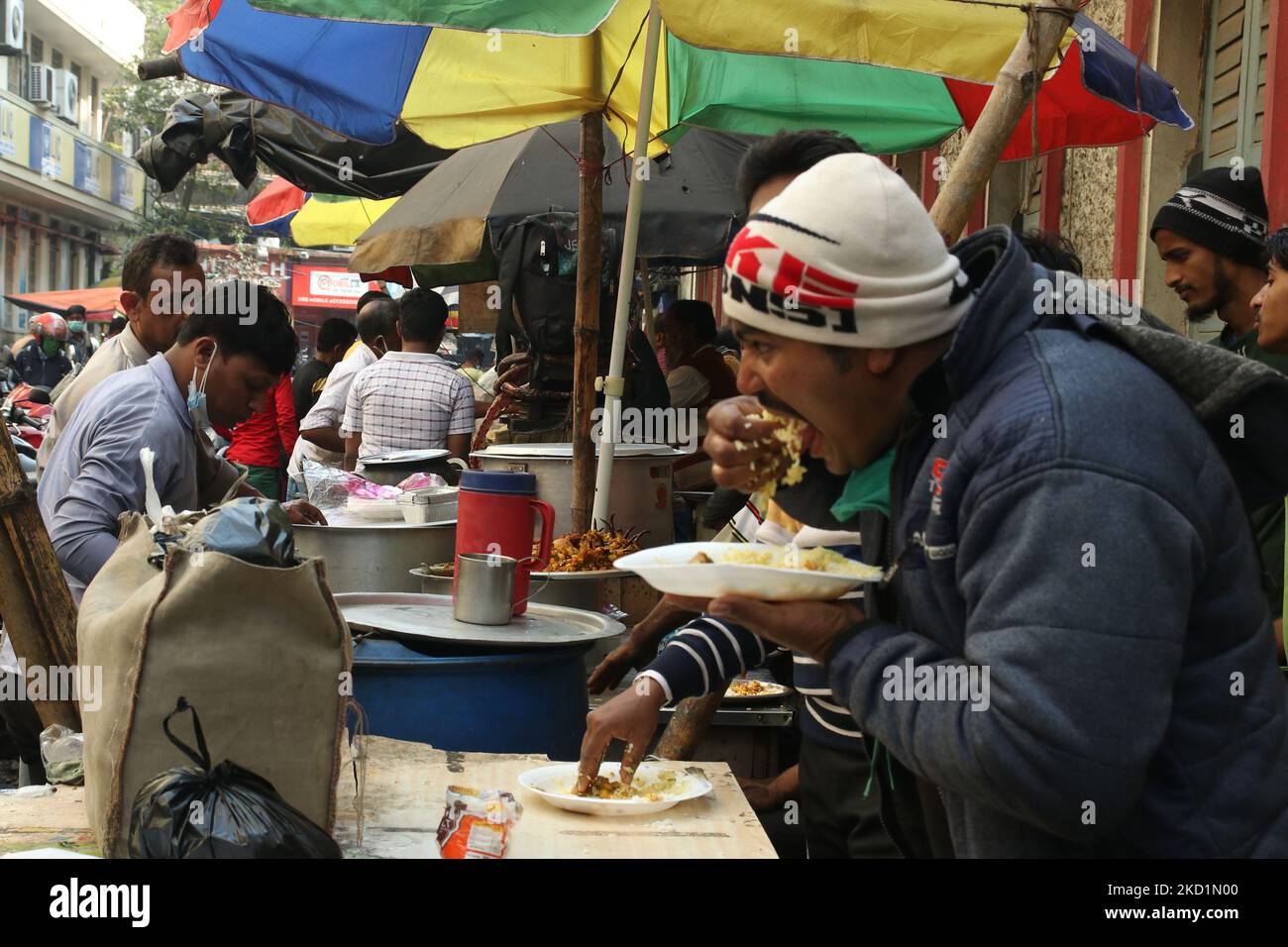 Indian Laborers push a cycle van loaded Goods across the Howrah Bridge ...