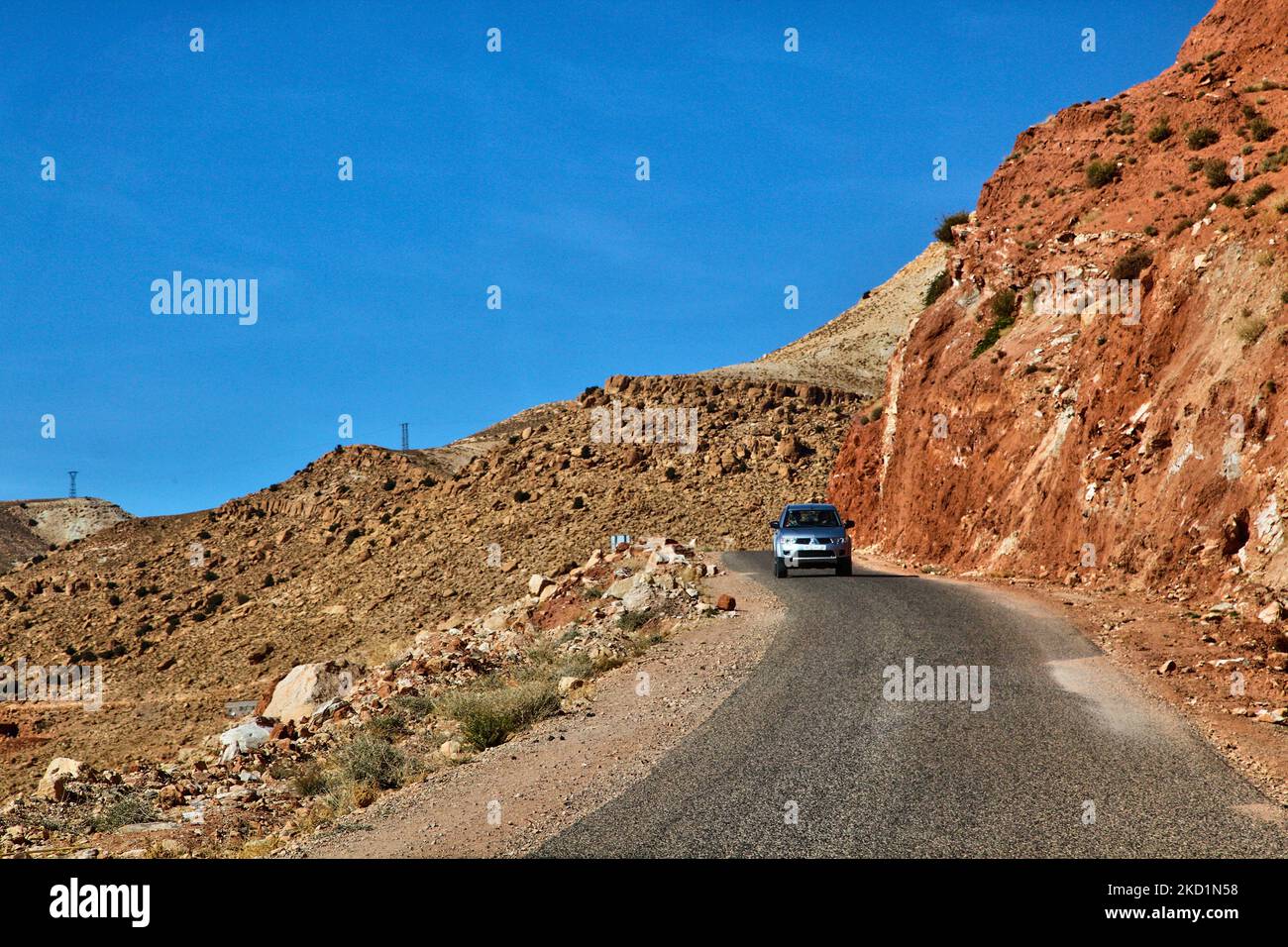 Vehicle drives along a mountain road by the small Berber village of ...