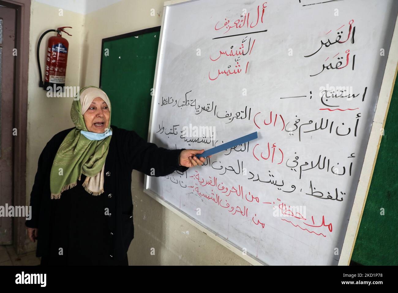 Elderly Palestinian women receive literacy lessons inside the Aged Care ...
