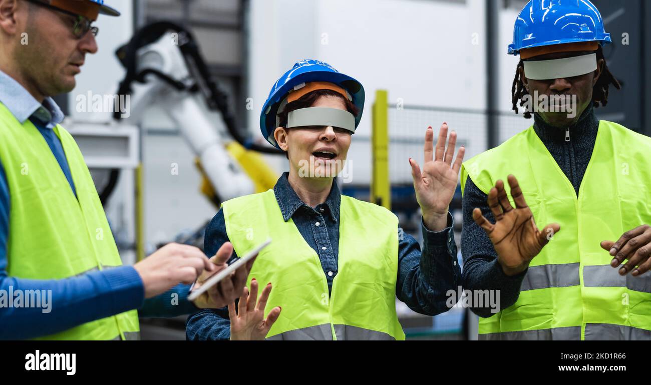 Team of engineers having simulation experience with futuristic virtual ...