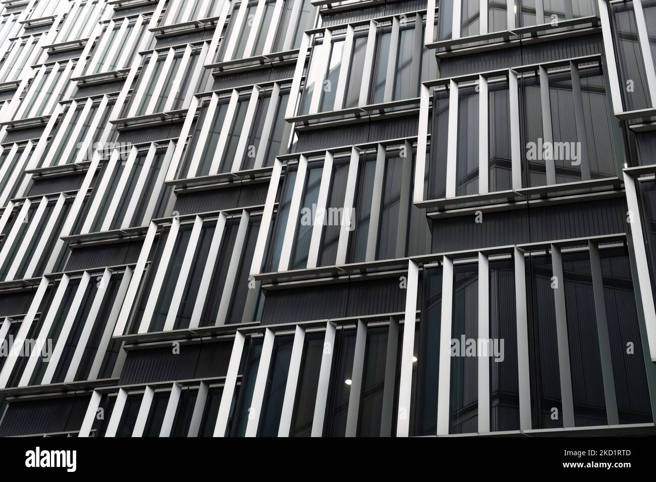 A greyscale shot of a modern building facade Stock Photo - Alamy