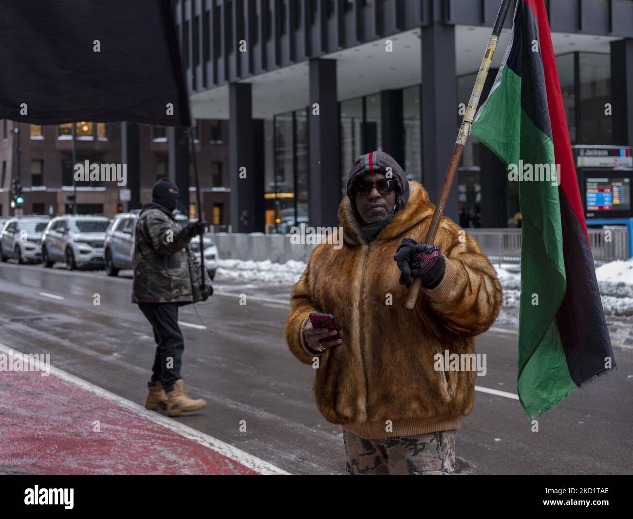 Protesters hold flags while blocking traffic outside of the Federal ...