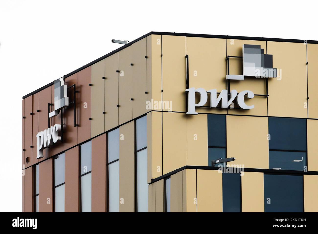 PricewaterhouseCoopers logo is seen on the office building in Krakow ...