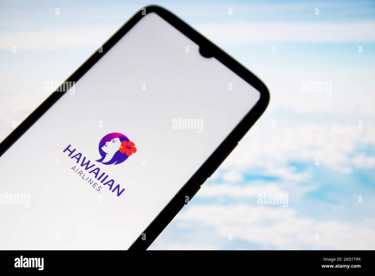 In this photo illustration a Hawaiian Airlines logo seen displayed on a ...
