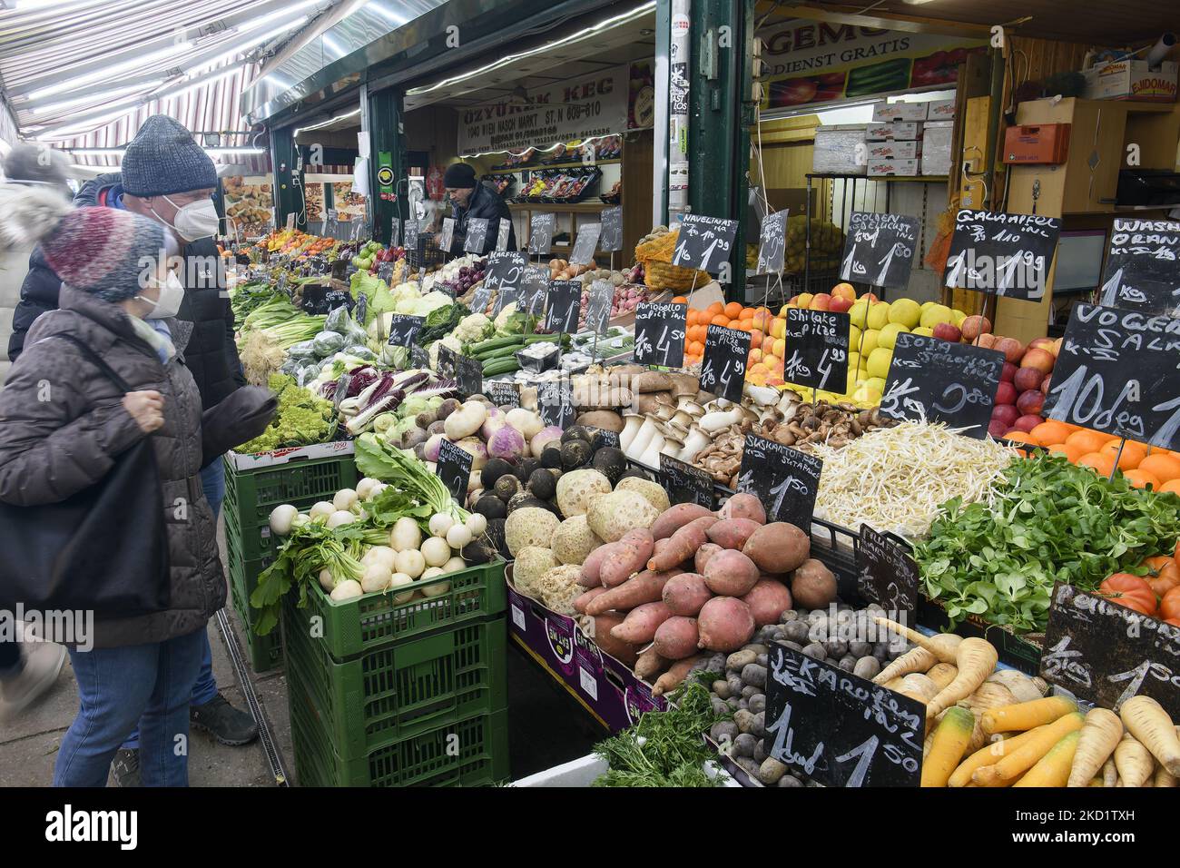 Showcases with food products on the Naschmarkt, most popular market in Vienna, Austria. January ...