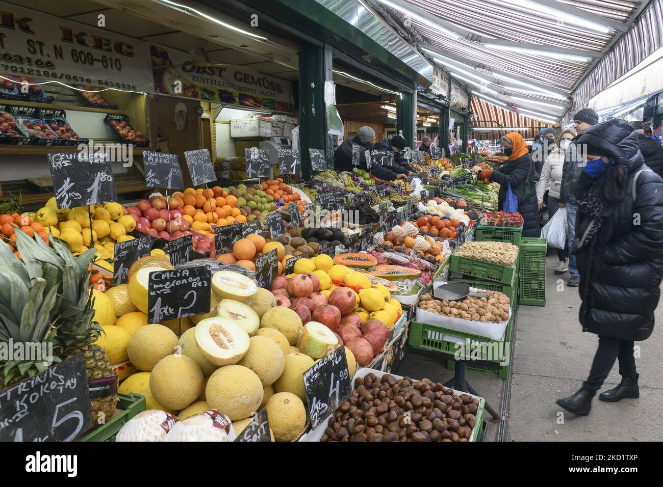 Showcases with food products on the Naschmarkt, most popular market in Vienna, Austria. January ...