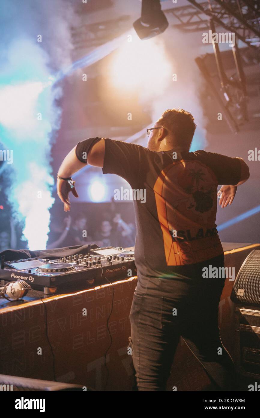 A male DJ on the stage during the electronic music festival ...