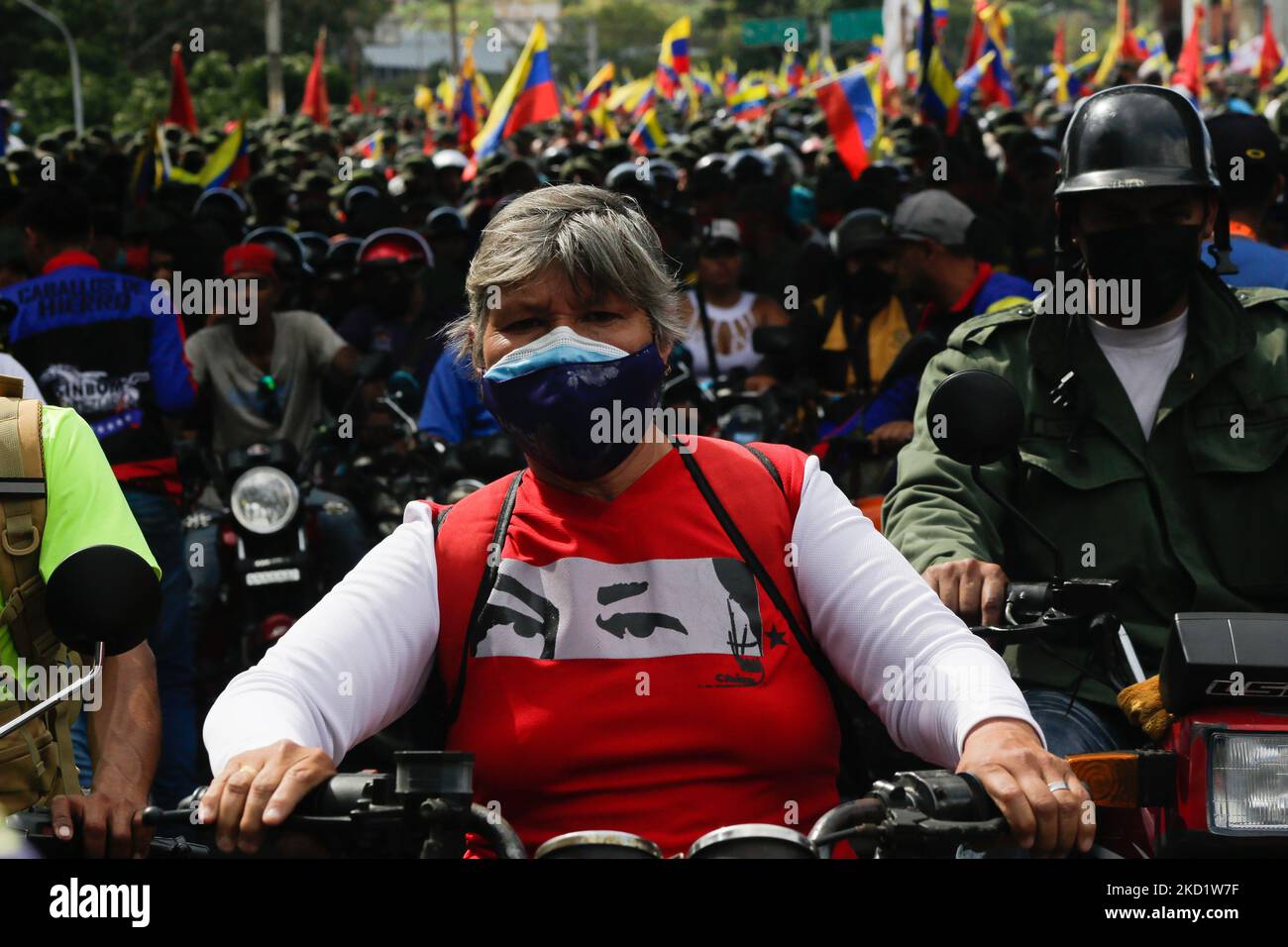 A woman motorcyclist wearing a flannel based on the look of late ...