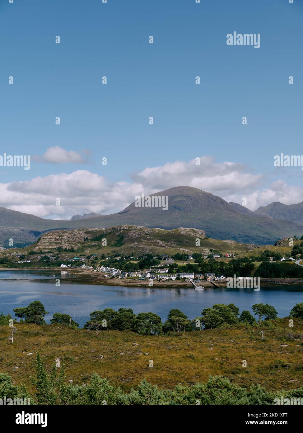 The summer loch and mountain landscape of Loch Shieldaig and village in ...