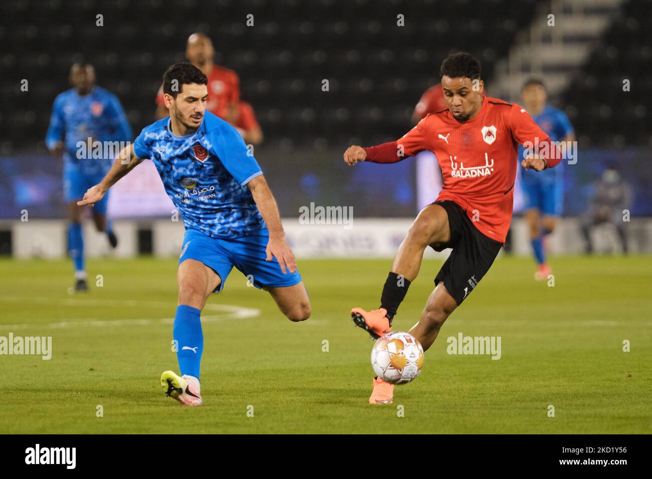Hashim Ali (17) of Al Rayyan tries to get past Mohammed Alaaeldin (3 ...