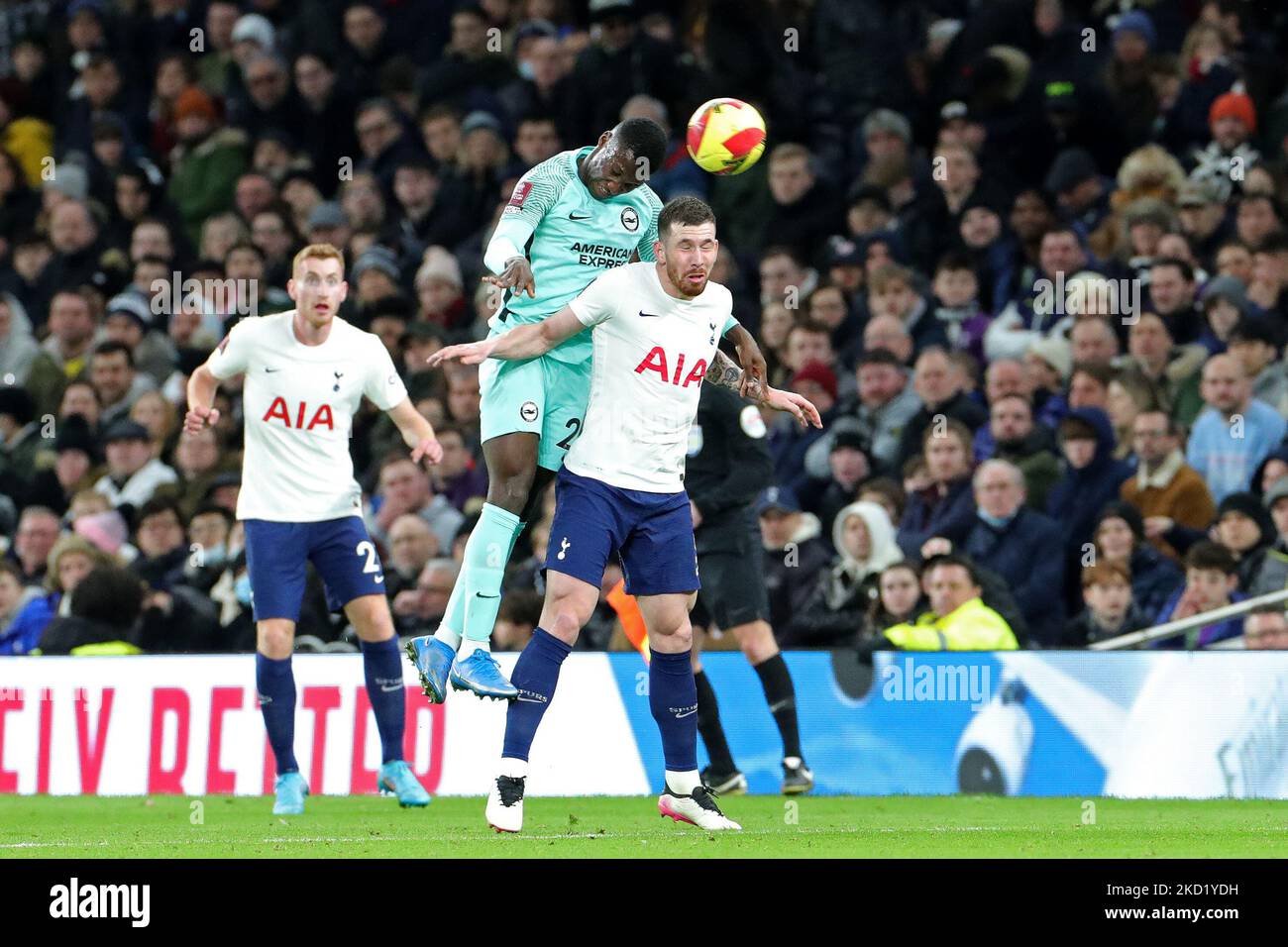 Brighton forward Danny Wellbeck wins the aerial challenge over ...
