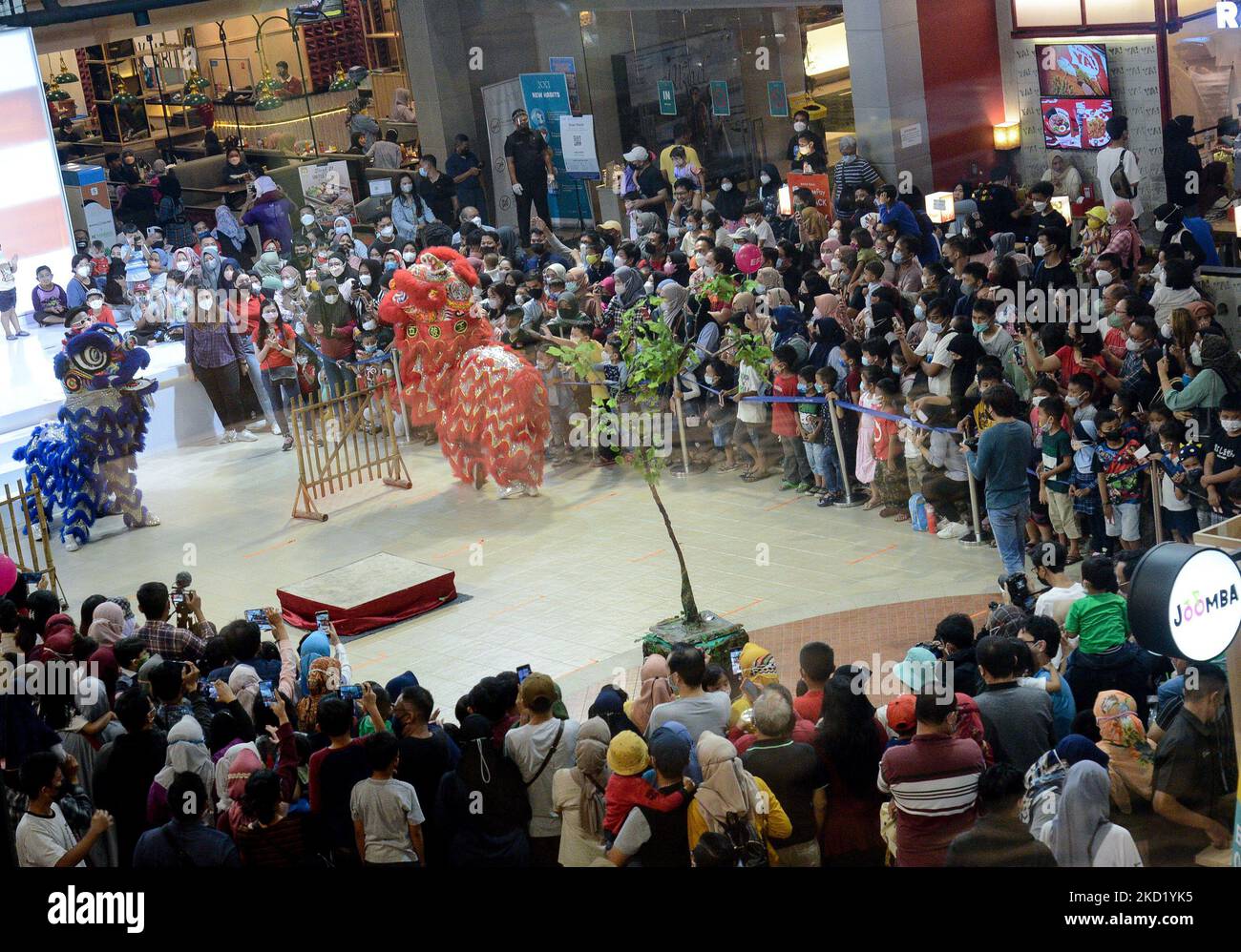Dancers perform the traditional Chinese lion dance to entertains ...