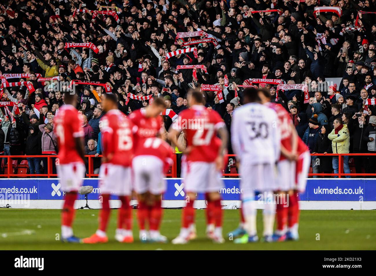 Nottingham Forest supporters holding up their teams scarlfs during the ...