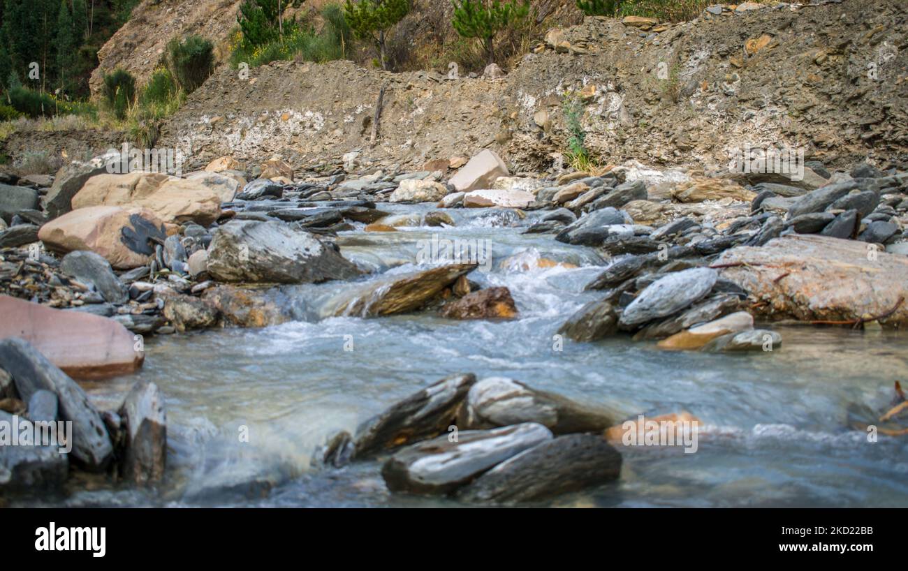 A scenery of a river flowing through the rocks Stock Photo - Alamy