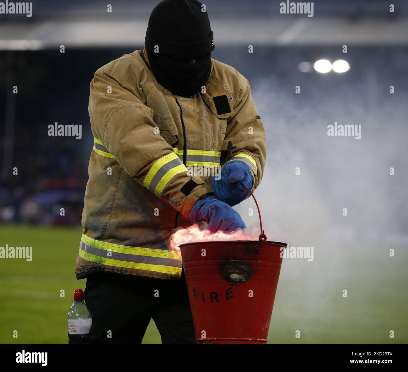 Fireman Staff remove a flare from pitch during FA Cup Fourth Round ...