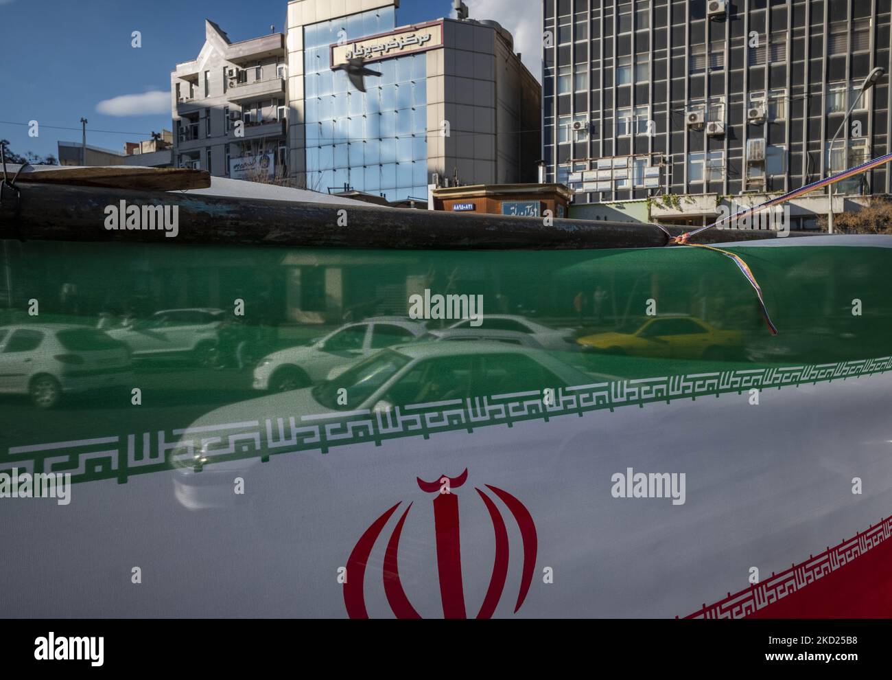 An Iran flag is hang in a square in downtown Tehran to mark the 43rd ...