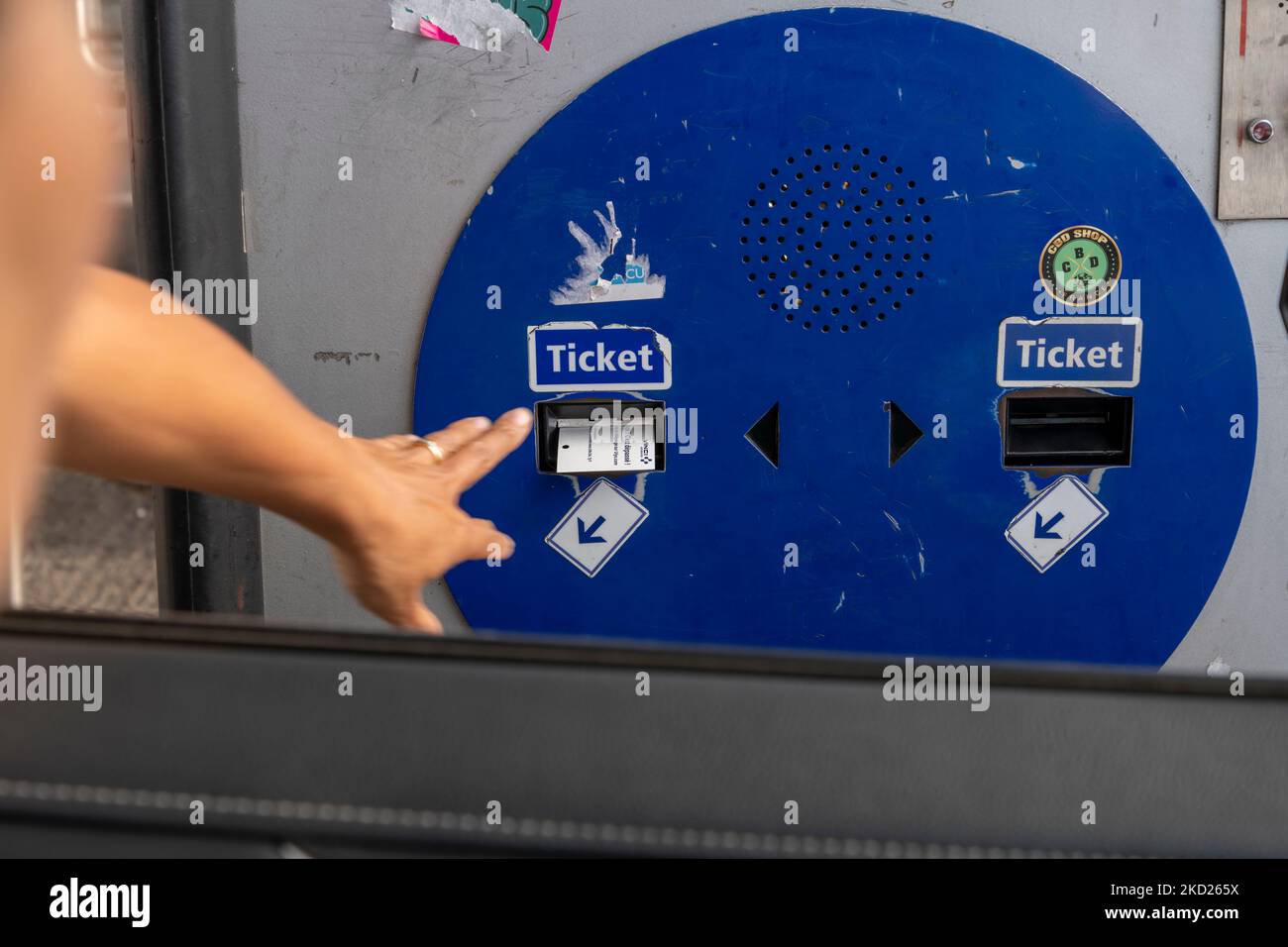 Female driver taking her toll ticket from the automatic machine Stock ...