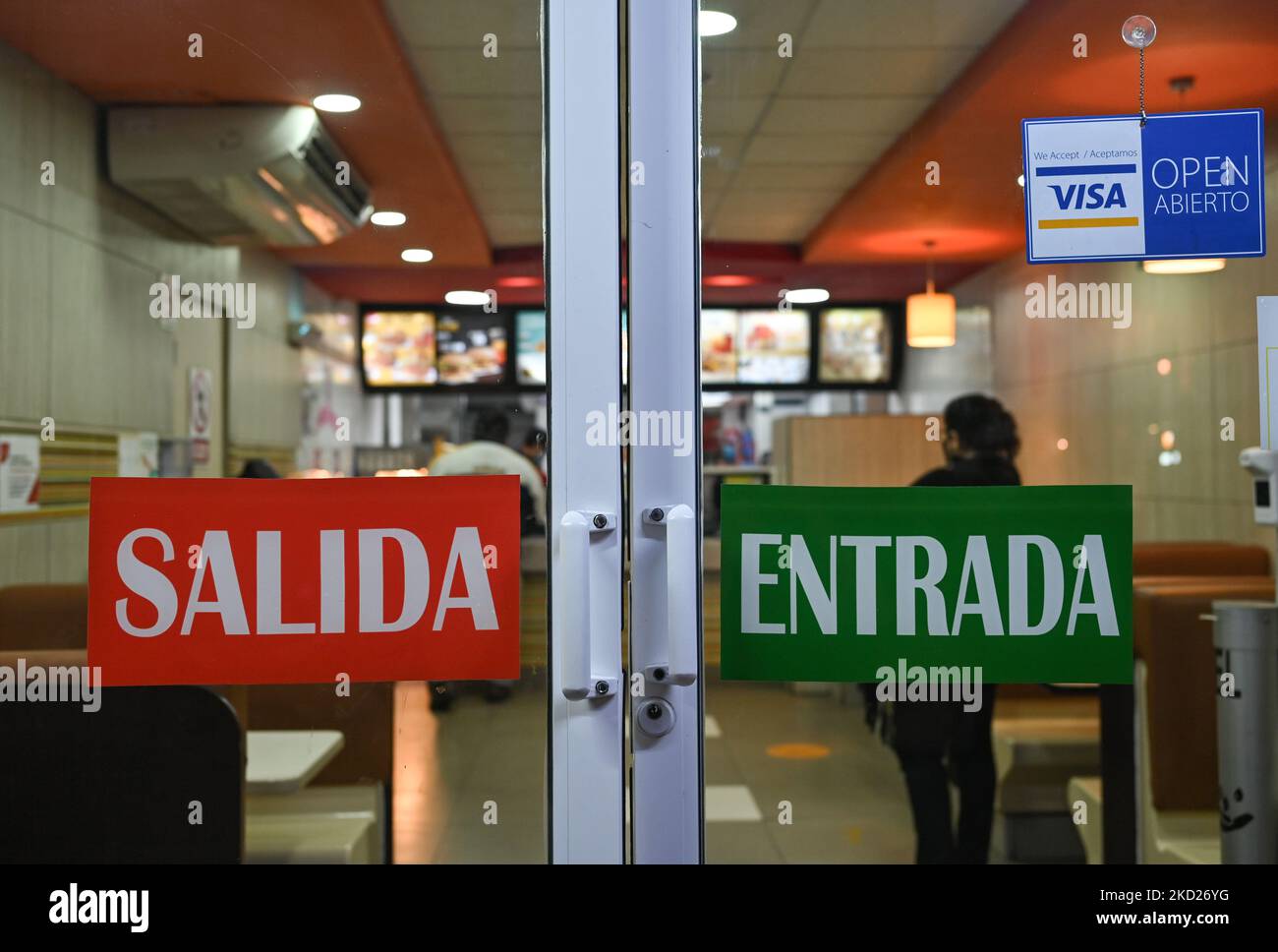 Entrance to a fast food restaurant with 'Entry and Exit' stickers on ...
