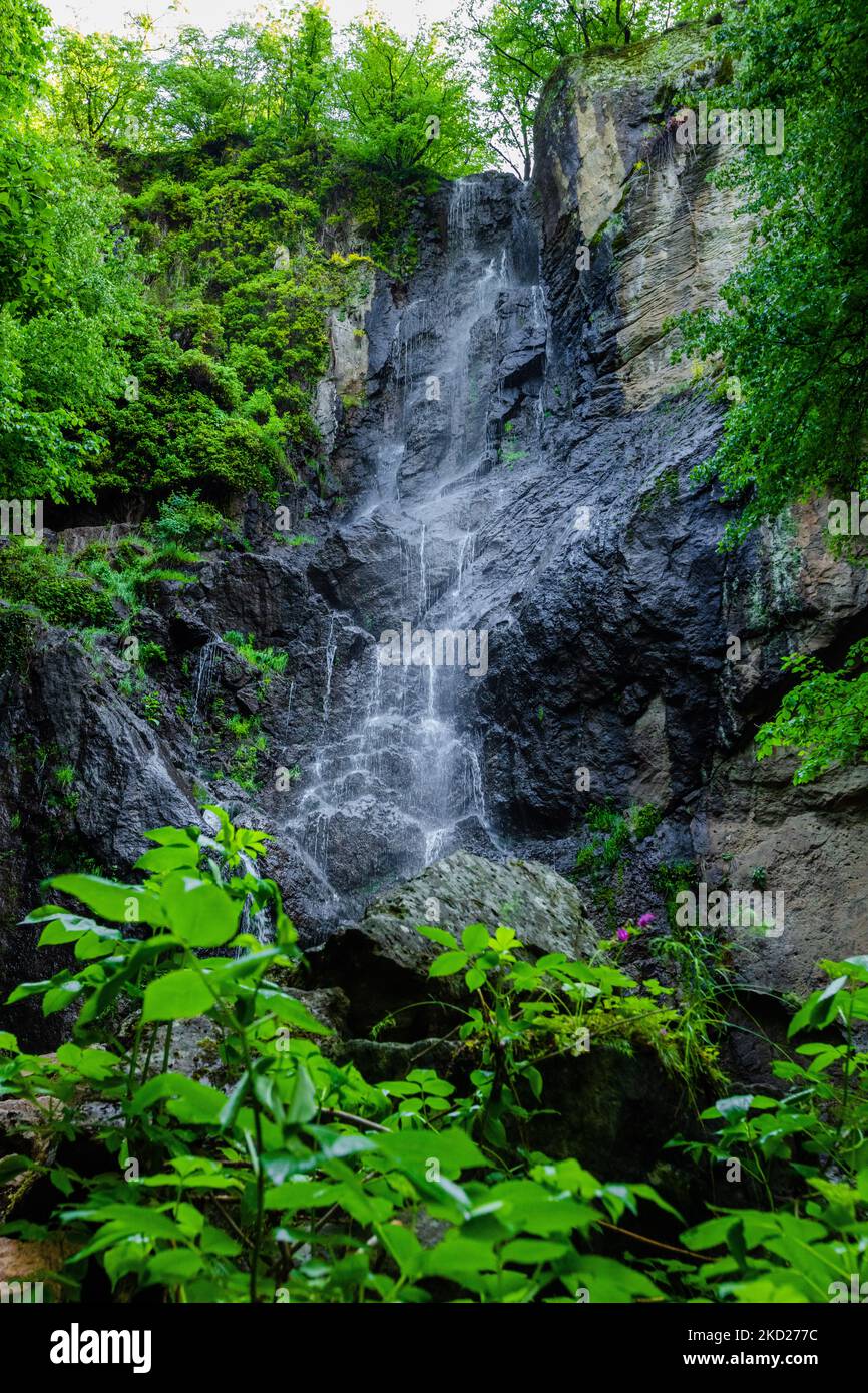 waterfall in deep mountain with large rocks Stock Photo - Alamy