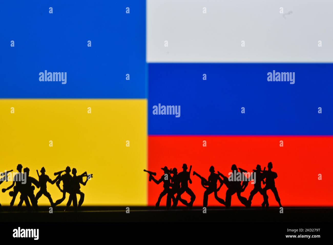 Illustrative photo of small figures of soldiers representing two armies ...