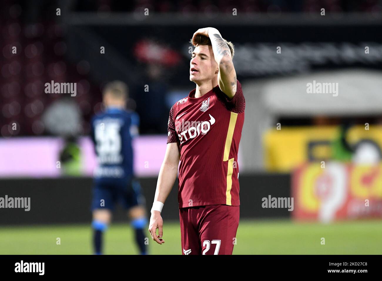 Claudiu Petrila, winger of CFR Cluj, reacts after the draw between CFR ...